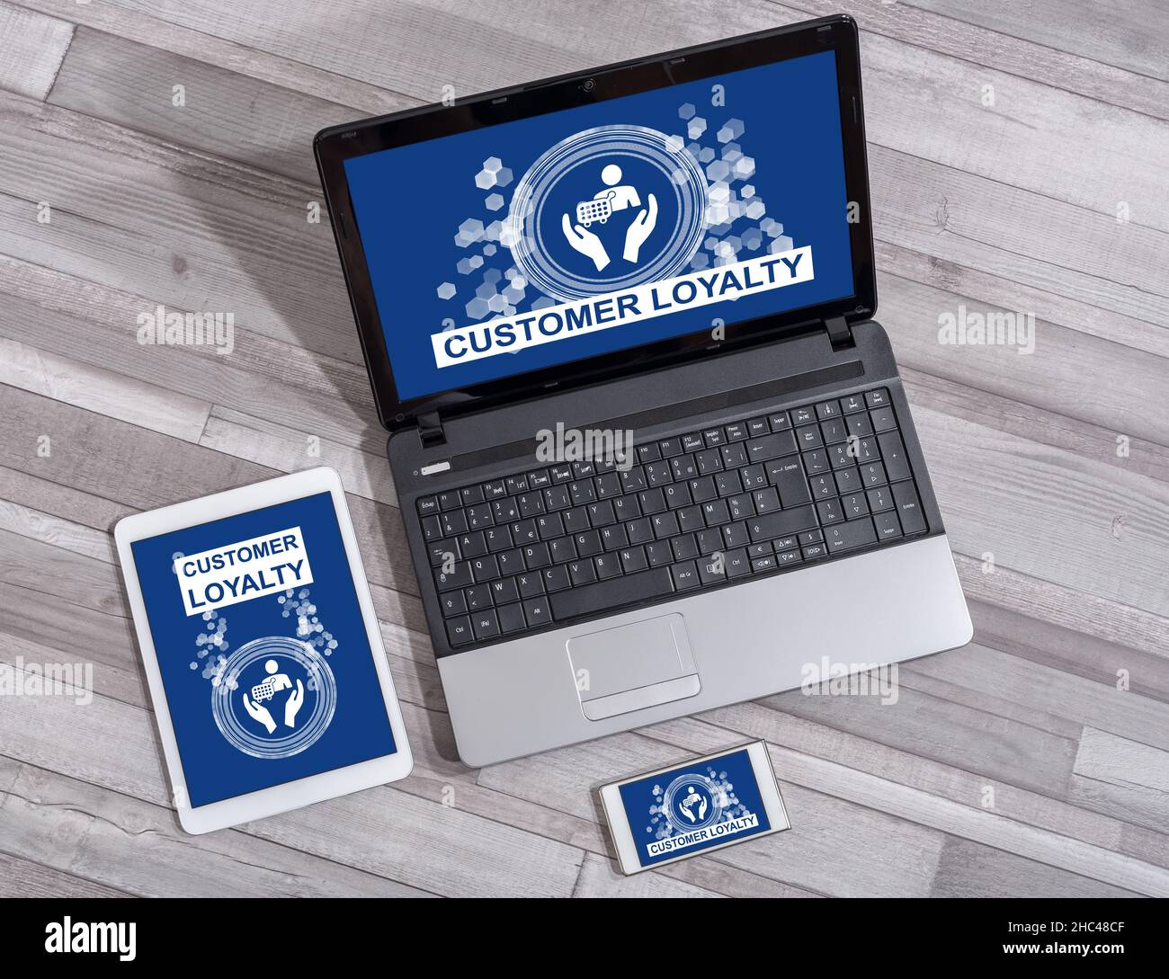 Customer loyalty concept shown on different information technology ...