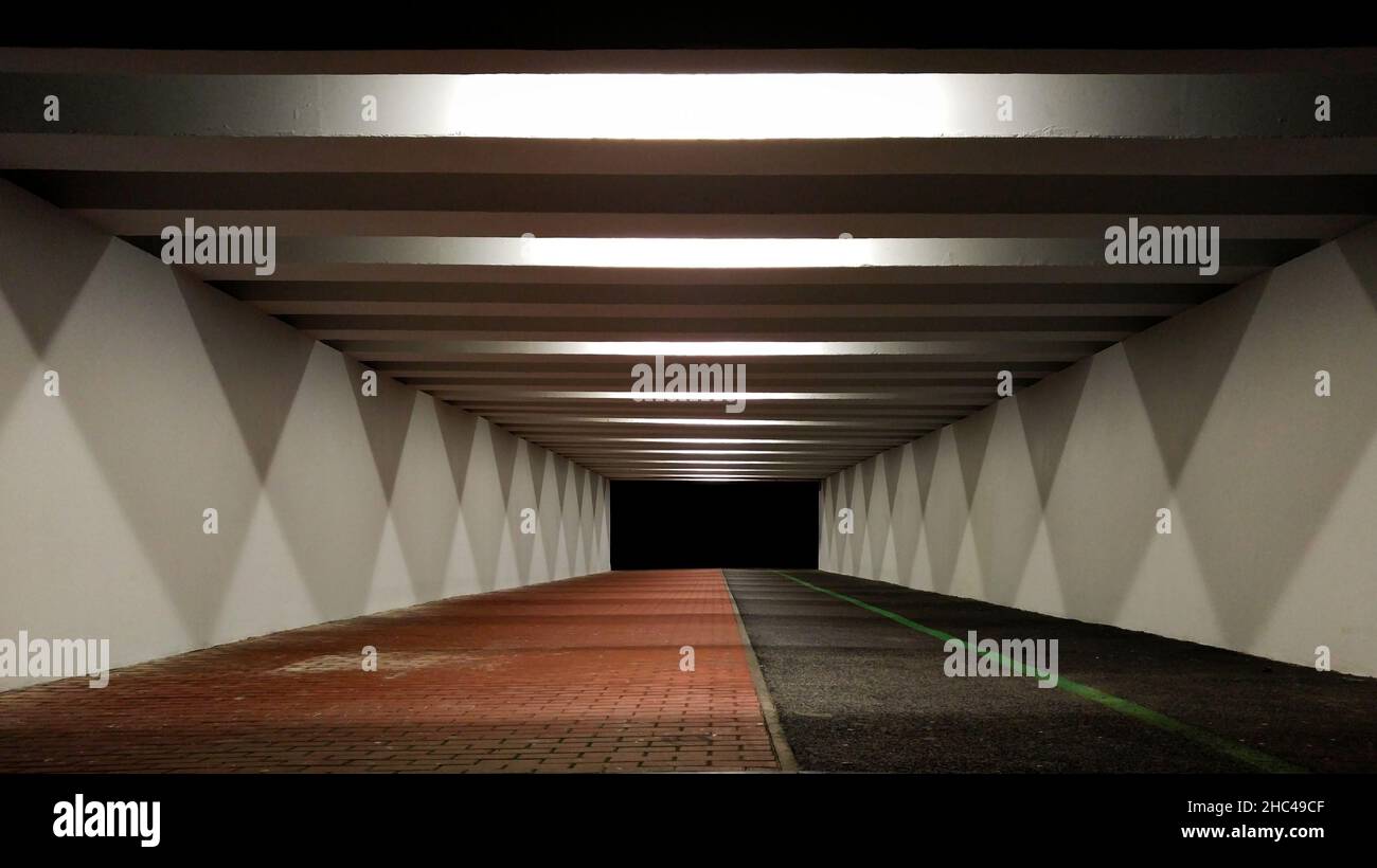 View of the inside of an illuminated tunnel Stock Photo - Alamy