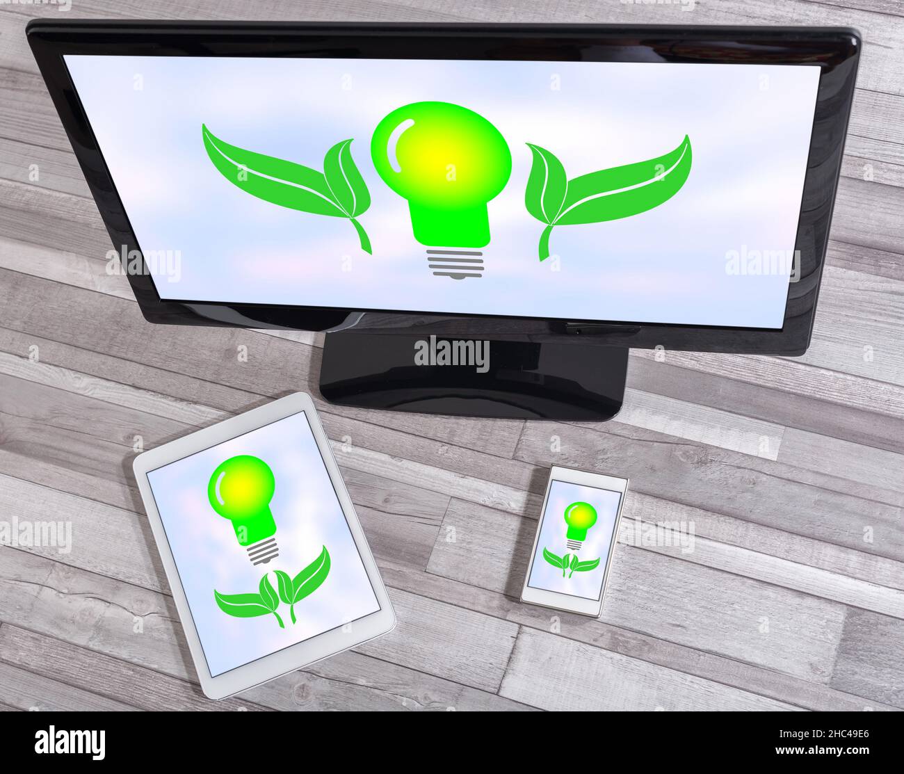 Green energy concept shown on different information technology devices ...