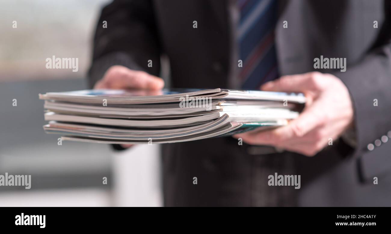 Pile of magazines with hands hi-res stock photography and images - Alamy