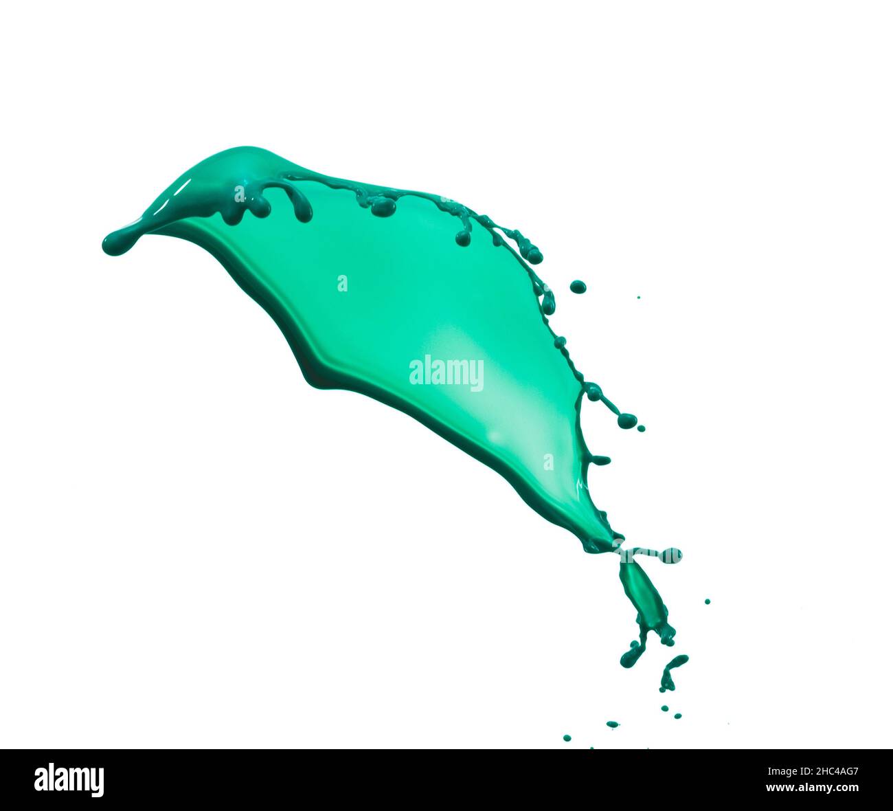 Flying splash of green color paint isolated on white background with ...