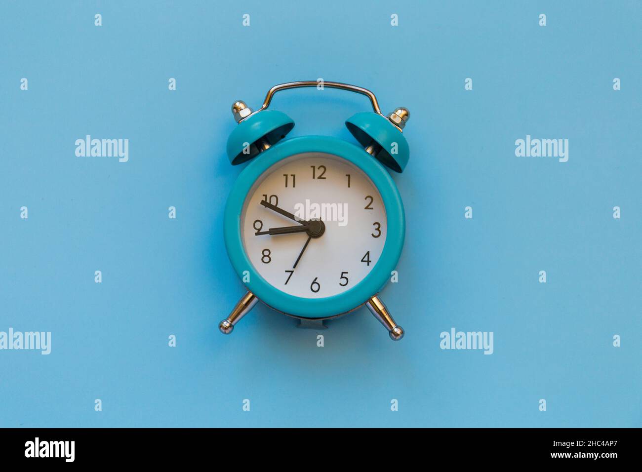 Clock, time symbol with copy space, blue background and top view Stock ...
