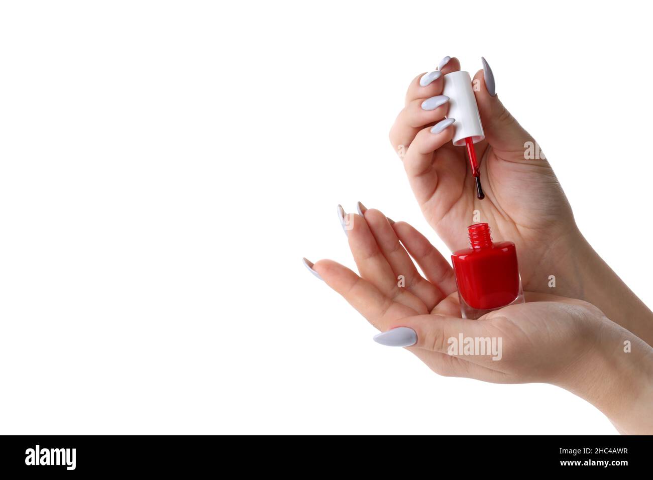 Female hands hold nail polish isolated on white background Stock Photo ...