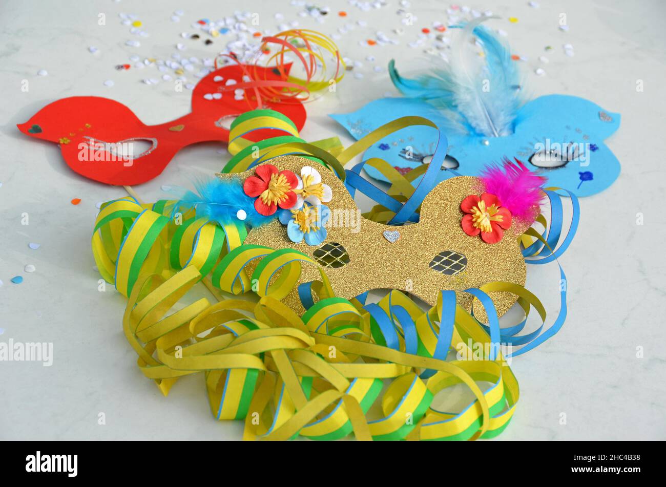 Carnival Masks With Paper Streamer And Confetti Stock Photo - Alamy
