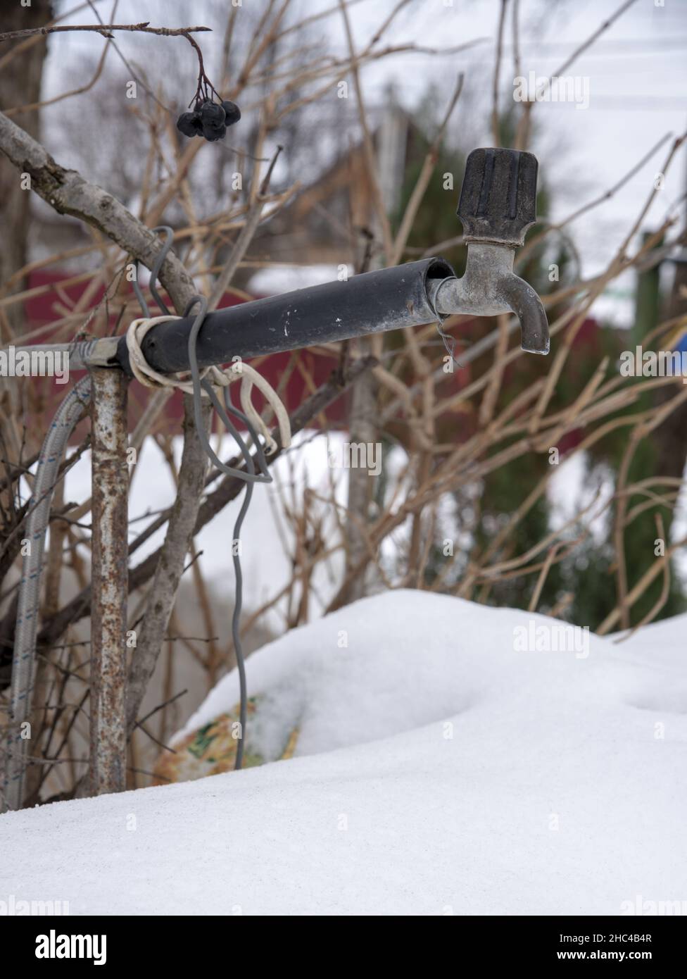 An old water tap, covered with snow Stock Photo - Alamy