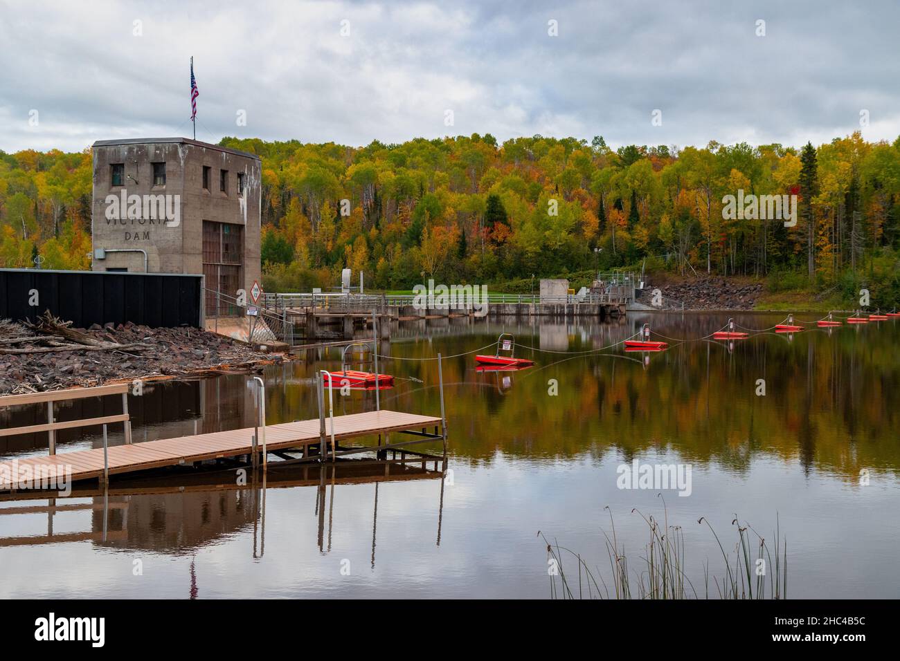 Landscape of the Victoria Dam Station in a forest in autumn in Michigan ...