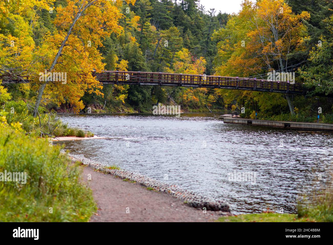Landscape of a bridge over the Victoria Dam in a forest in autumn in ...
