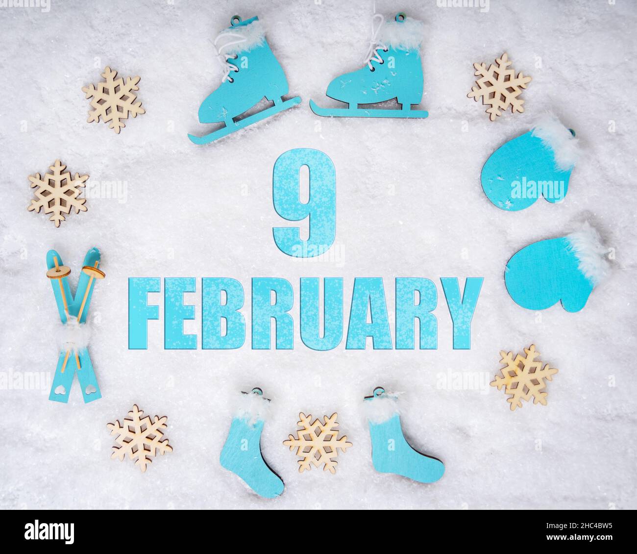 February 9th. Sports set with blue wooden skates, skis, sledges and ...