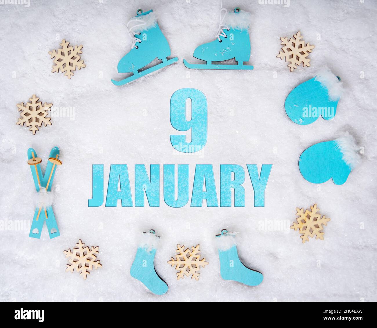 January 9th. Sports set with blue wooden skates, skis, sledges and ...