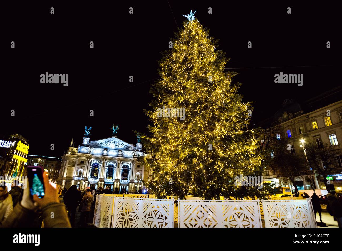 LVIV, UKRAINE - DECEMBER 23, 2021 - The Christmas tree sparkles outside ...