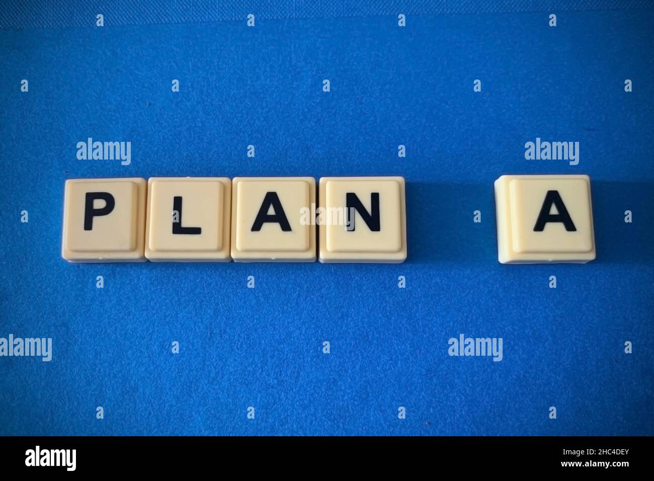 Words PLAN A on cube blocks with dark blue background. Business concept ...