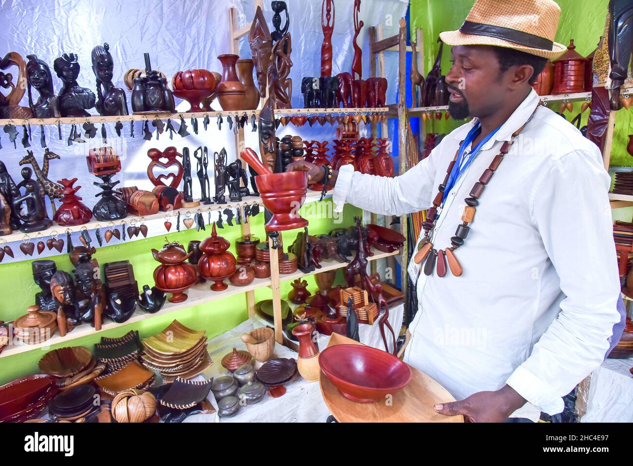 Yaounde, Cameroon. 21st Dec, 2021. An exhibitor displays wooden objects ...