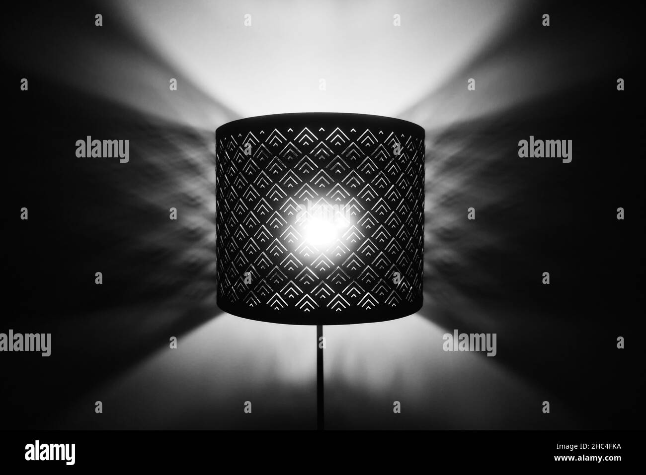 Floor lamp light. Rays of light through the holes in the lamp floor ...
