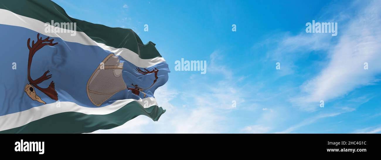 flag of Innu Nation , Canada at cloudy sky background on sunset ...