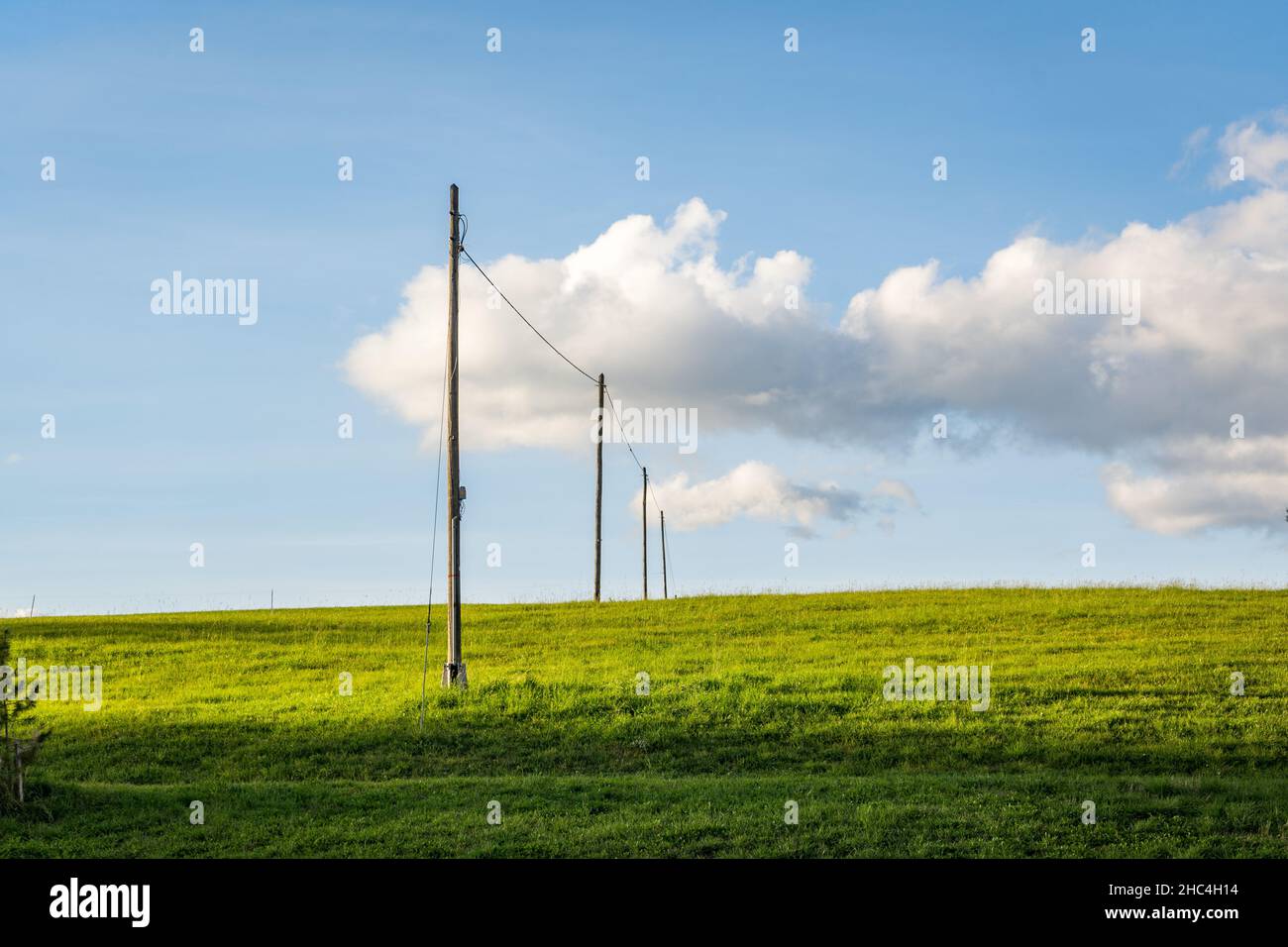 old electric power supply on the midle of a field on sunny day Stock ...