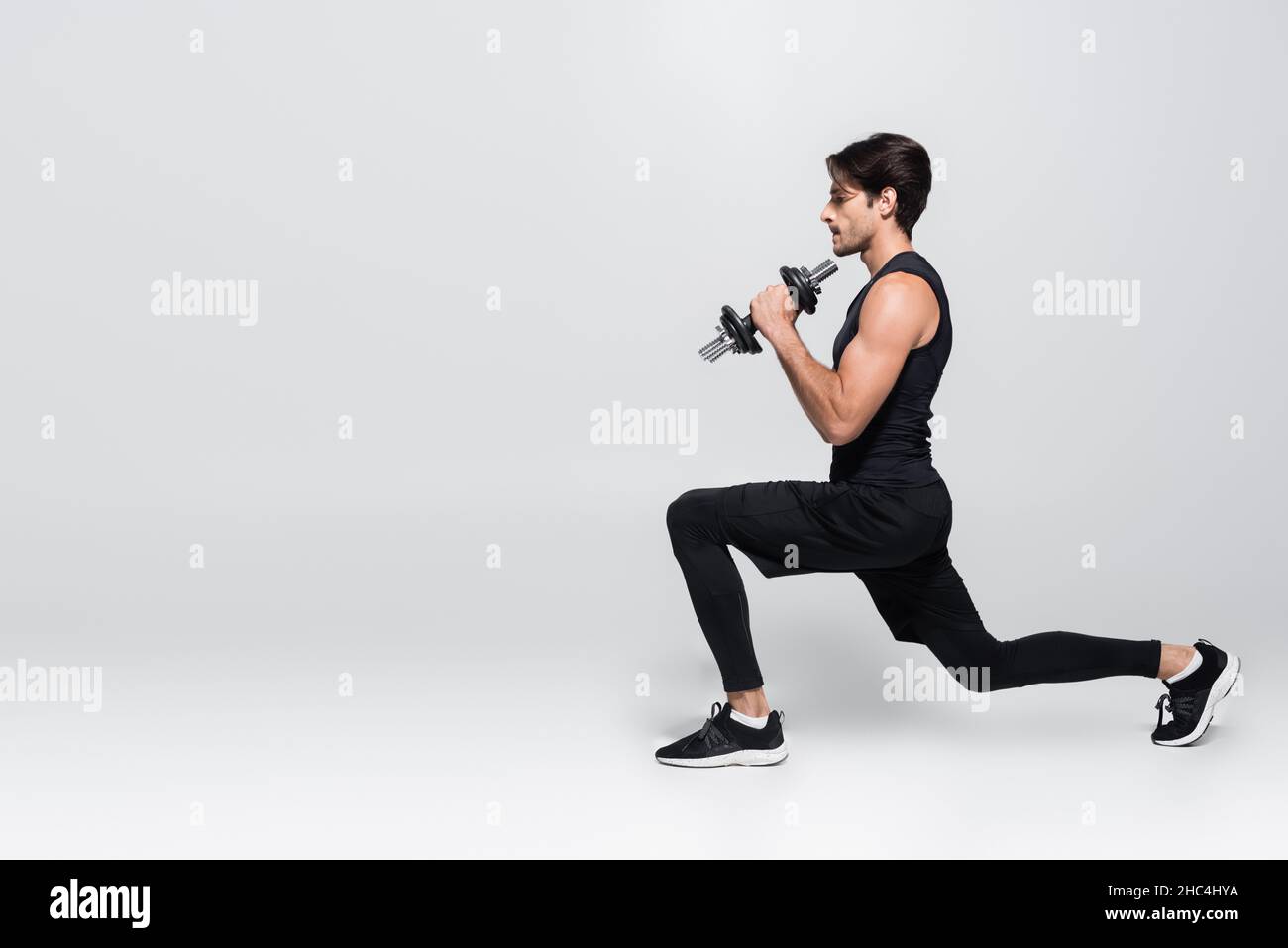 Sportive man doing lunges hi-res stock photography and images - Alamy