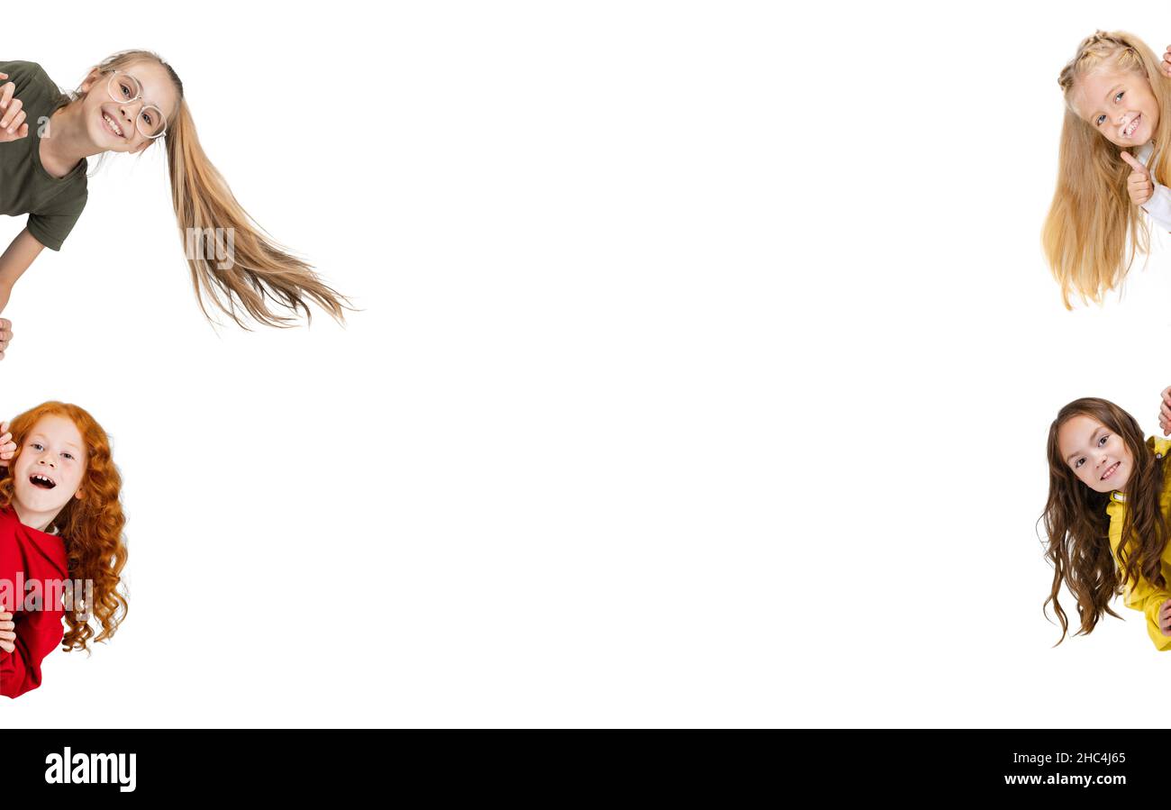 Collage of four beautiful children, cheerful girls smiling, peaking out ...