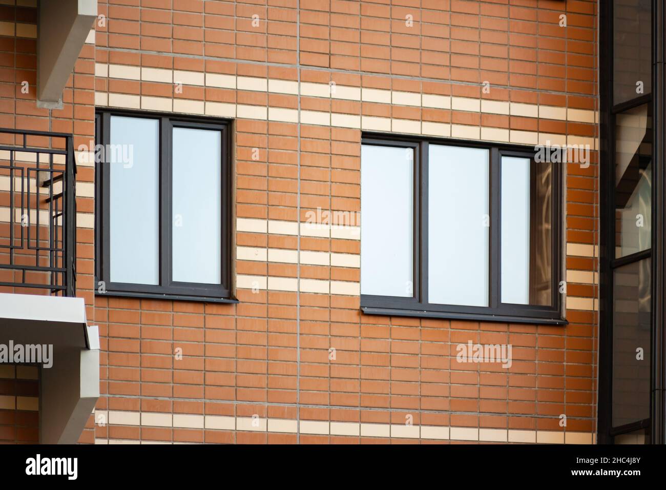 laminated plastic windows on the facade of apartment buildings Stock ...