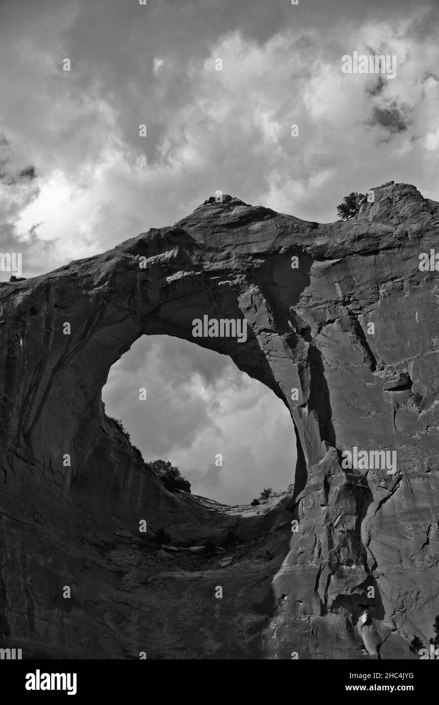 Clouds roll by in the sky behind the majesty of Window Rock, Window ...