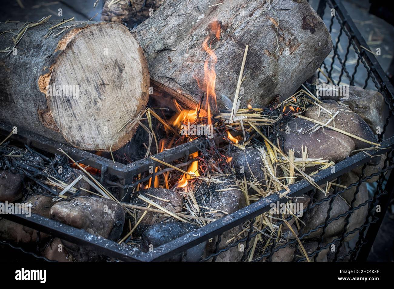 A close-up of burning logs and straw Stock Photo - Alamy