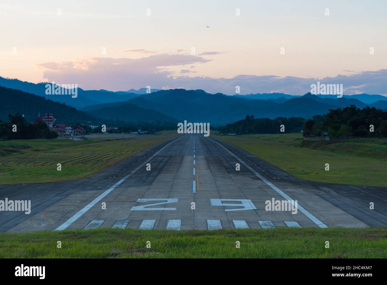 Airport runway sunset. Background mountain and sunset in Thailand Stock ...