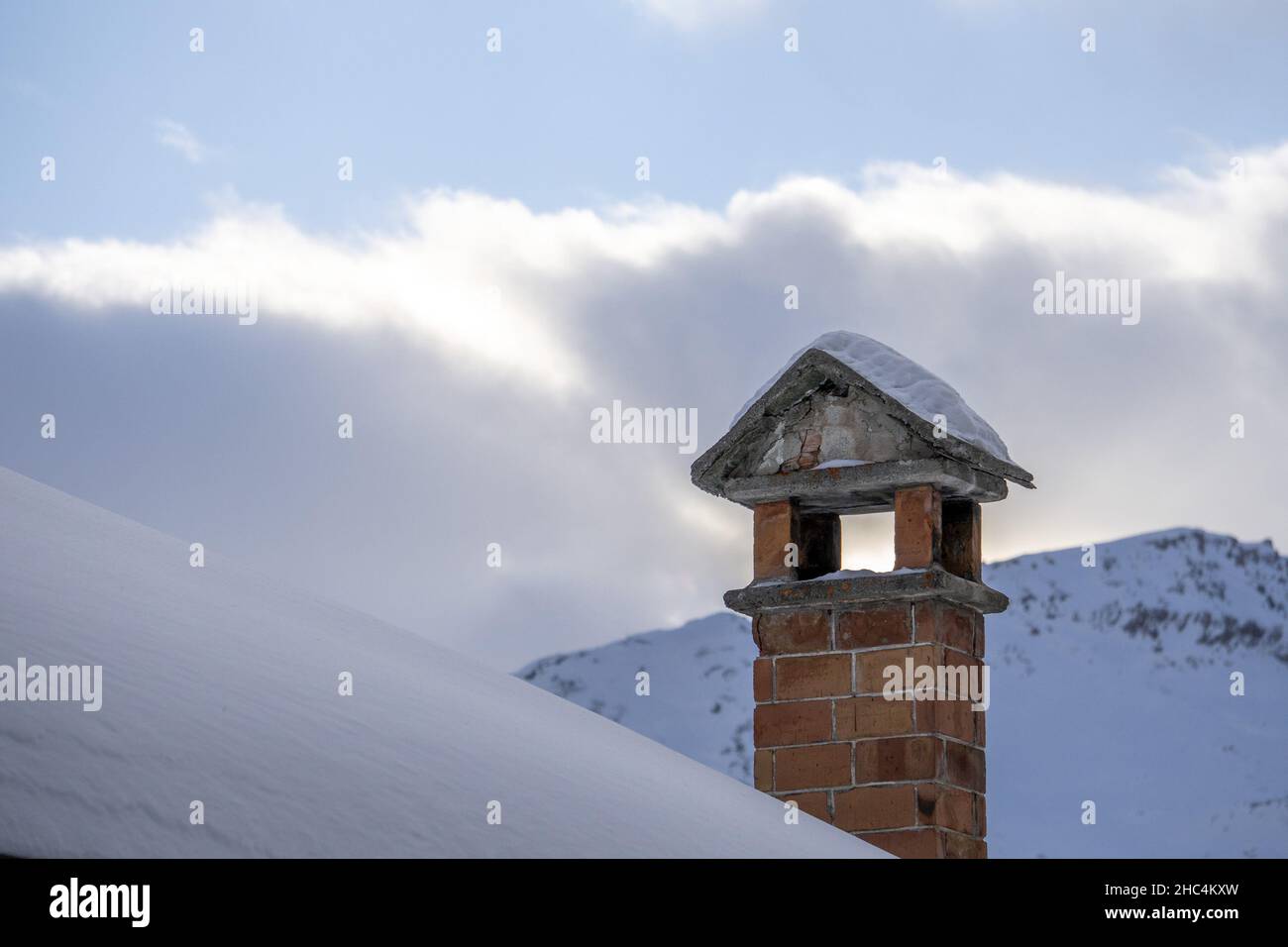 chimney of mountain house covered by snow in dolomites detail Stock ...
