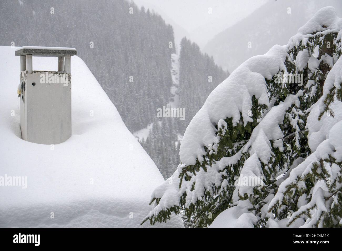 chimney of mountain house covered by snow in dolomites detail Stock ...