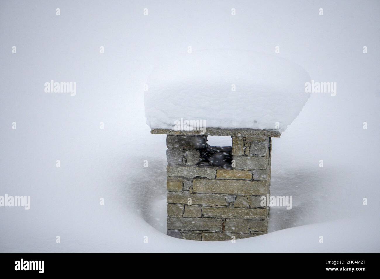 chimney of mountain house covered by snow in dolomites detail Stock ...