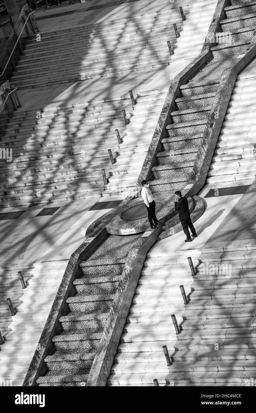 Two men on deserted steps at the former World Expo site in Pudong ...
