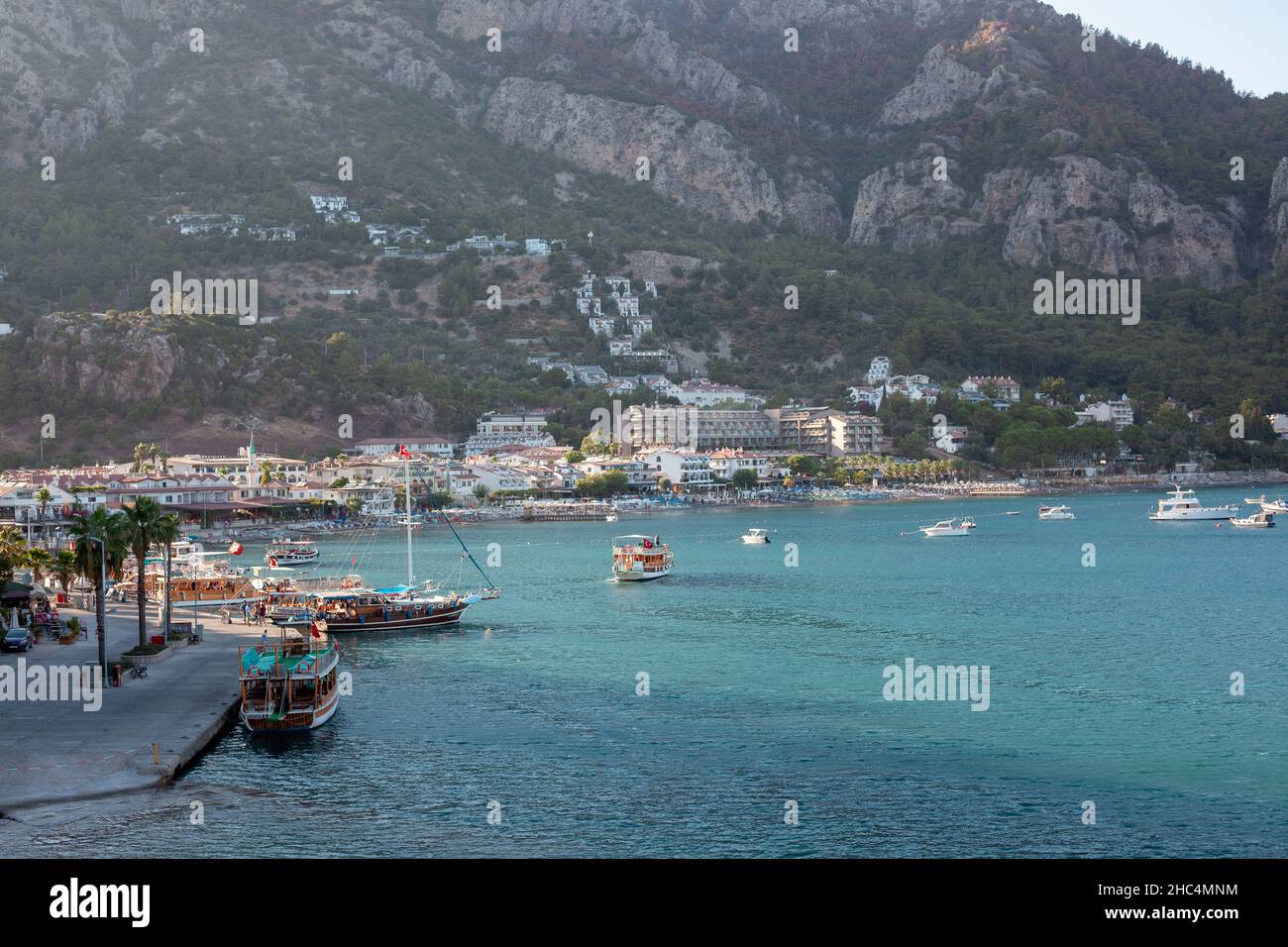Sea bay surrounded by mountains and rocks in small touristic village ...