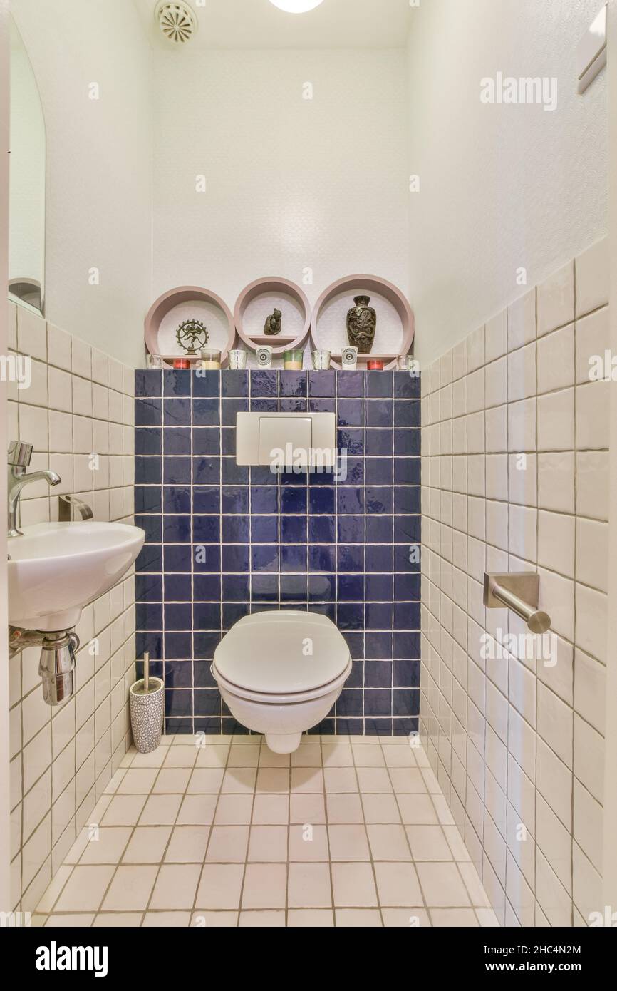 Interior of small clean restroom in miniature style Stock Photo - Alamy