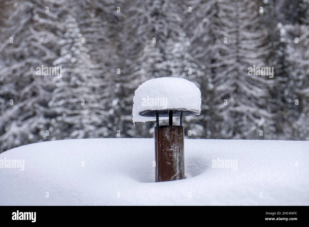 chimney of mountain house covered by snow in dolomites detail Stock ...