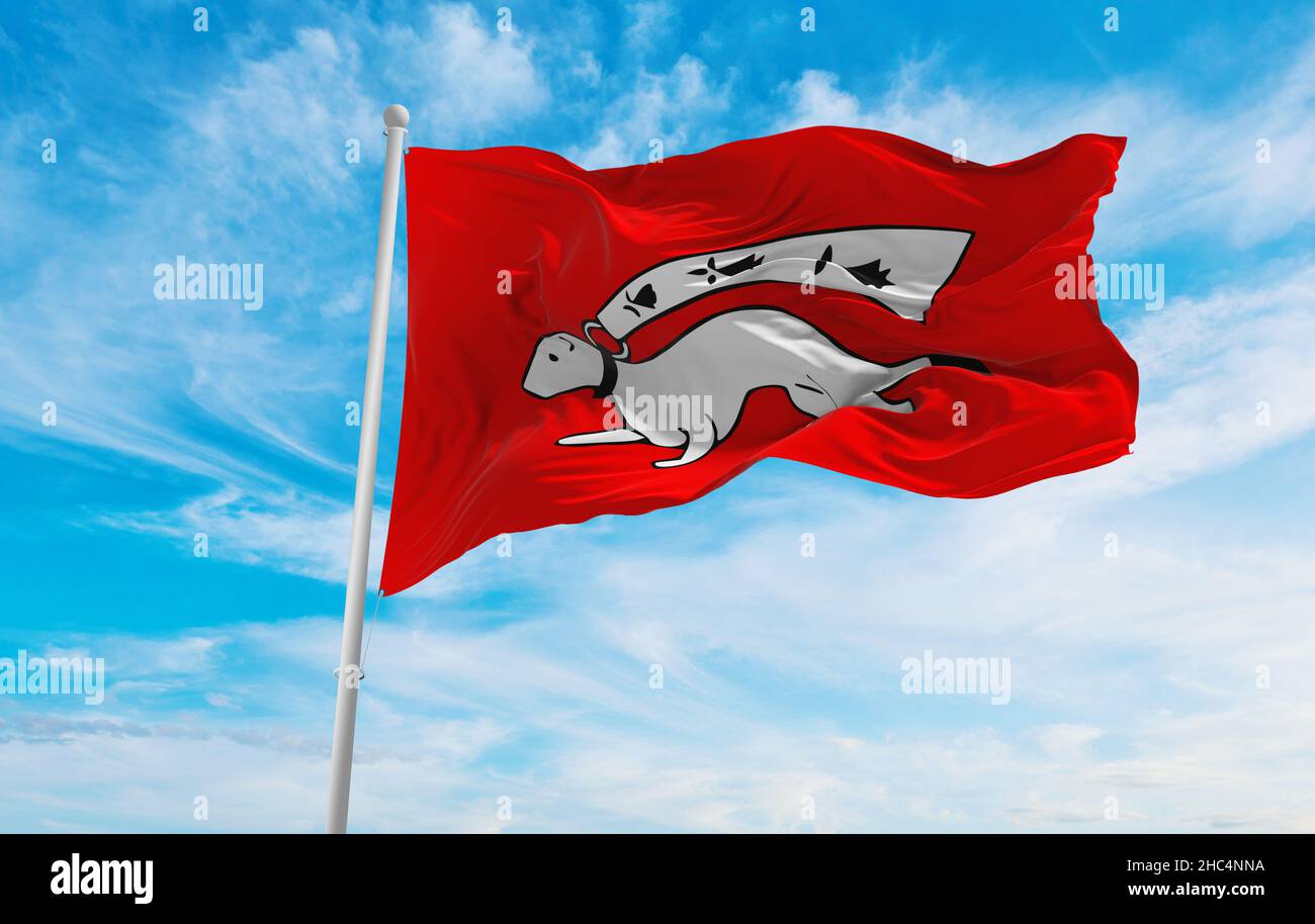 flag of department of Vannes, France at cloudy sky background on sunset ...