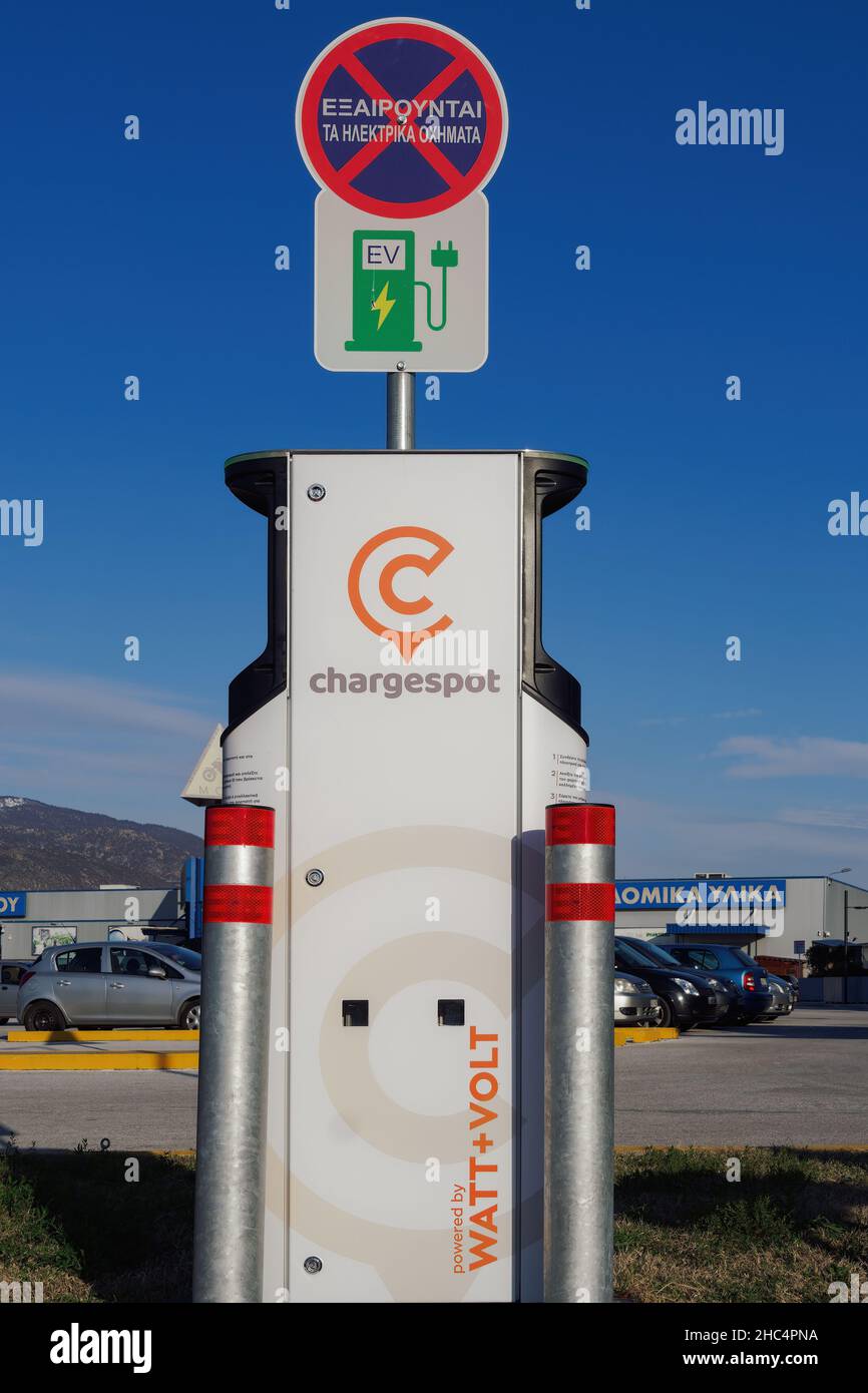 EV electric car power station with Watt and Volt logo. Day view of ...