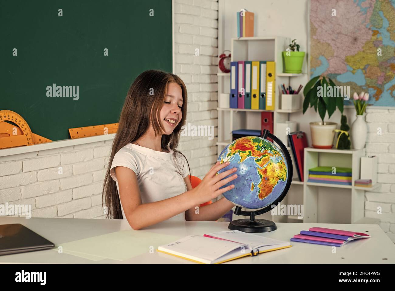 find a place. child with globe. college student kid do homework. happy ...