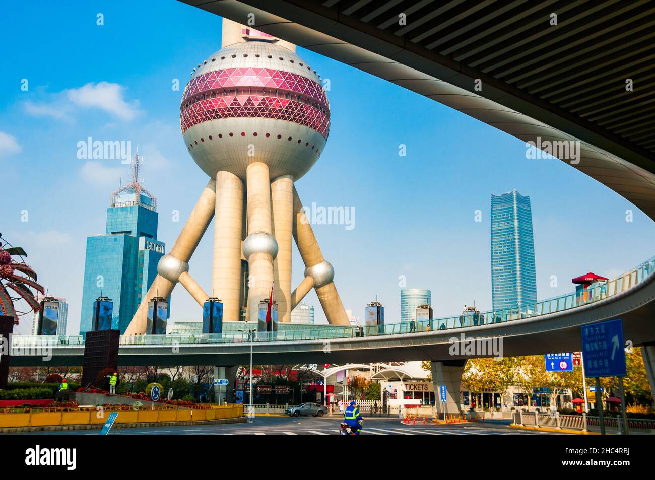 The Oriental Pearl TV Tower framed by the pedestrian bridge in Lujiazui ...