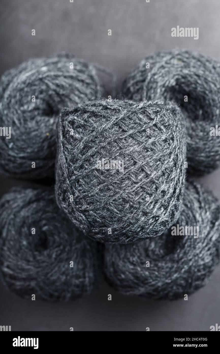 Tangles of gray yarn made of natural wool close-up in full screen Stock ...