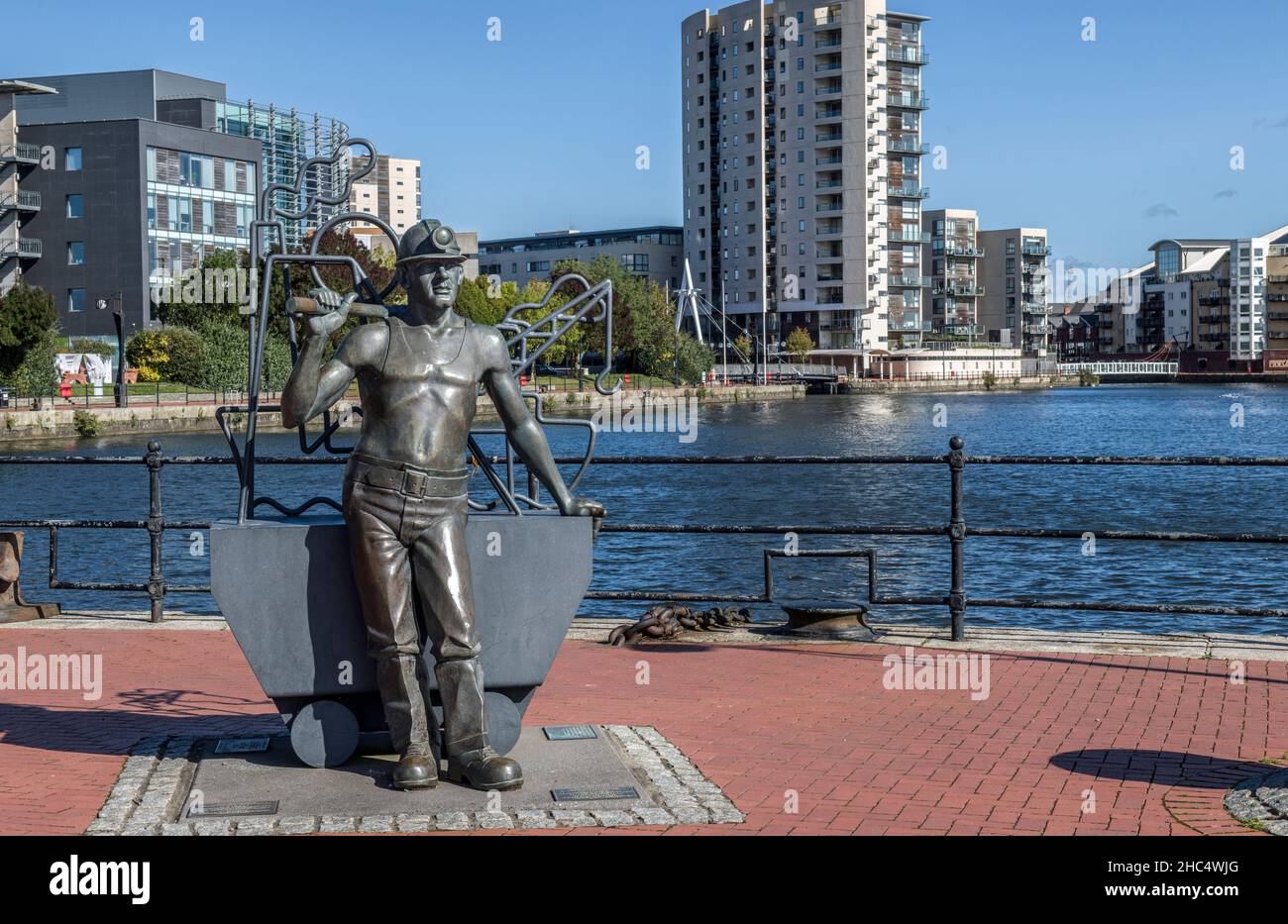 The statue of a welsh coal miner in Cardiff Bay, at Roath Basin ...