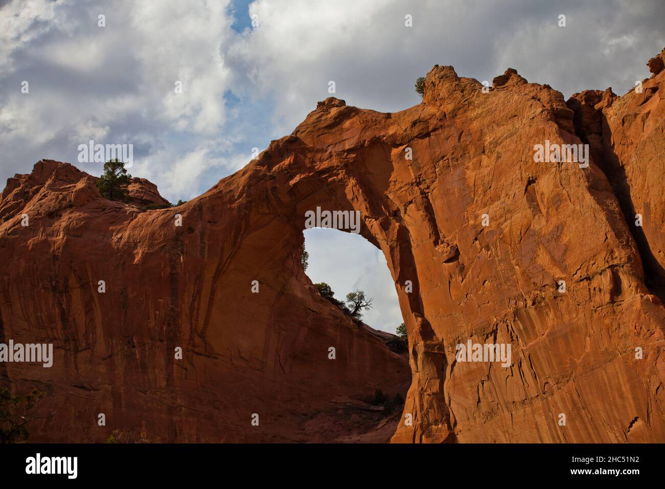 Clouds roll by in the sky behind the majesty of Window Rock, Window ...