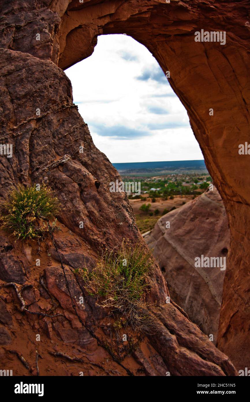 Clouds roll by in the sky behind the majesty of Window Rock, Window Rock, Arizona, USA, 5 June ...