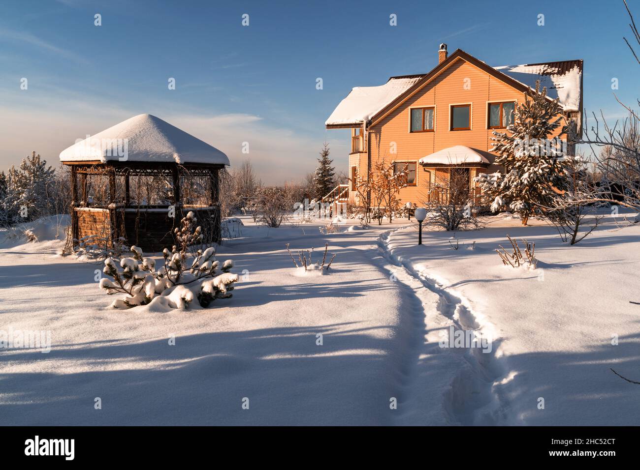 Winter landscape in countryside and Country house with tiled roof and ...