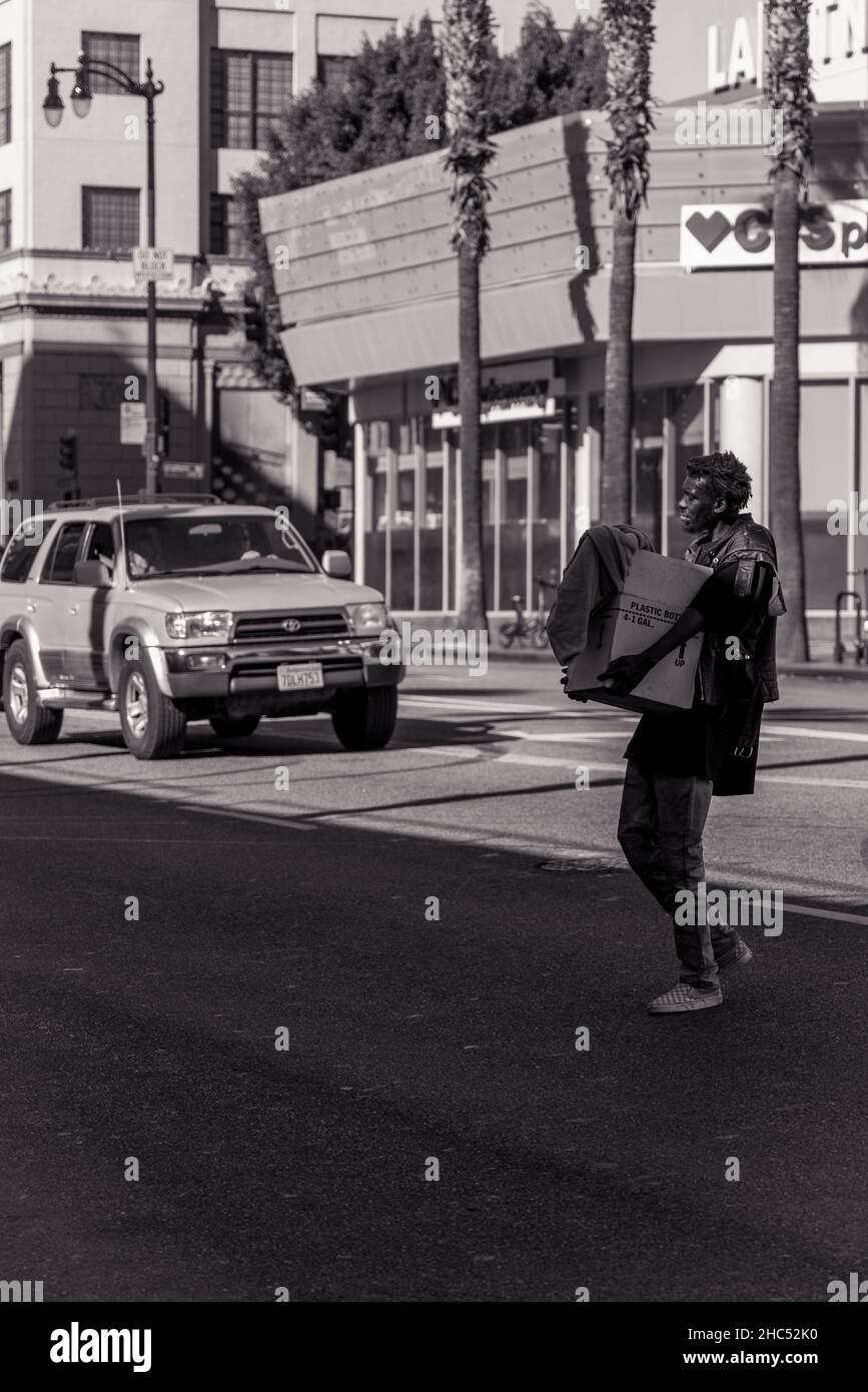Man carrying box street hi-res stock photography and images - Alamy