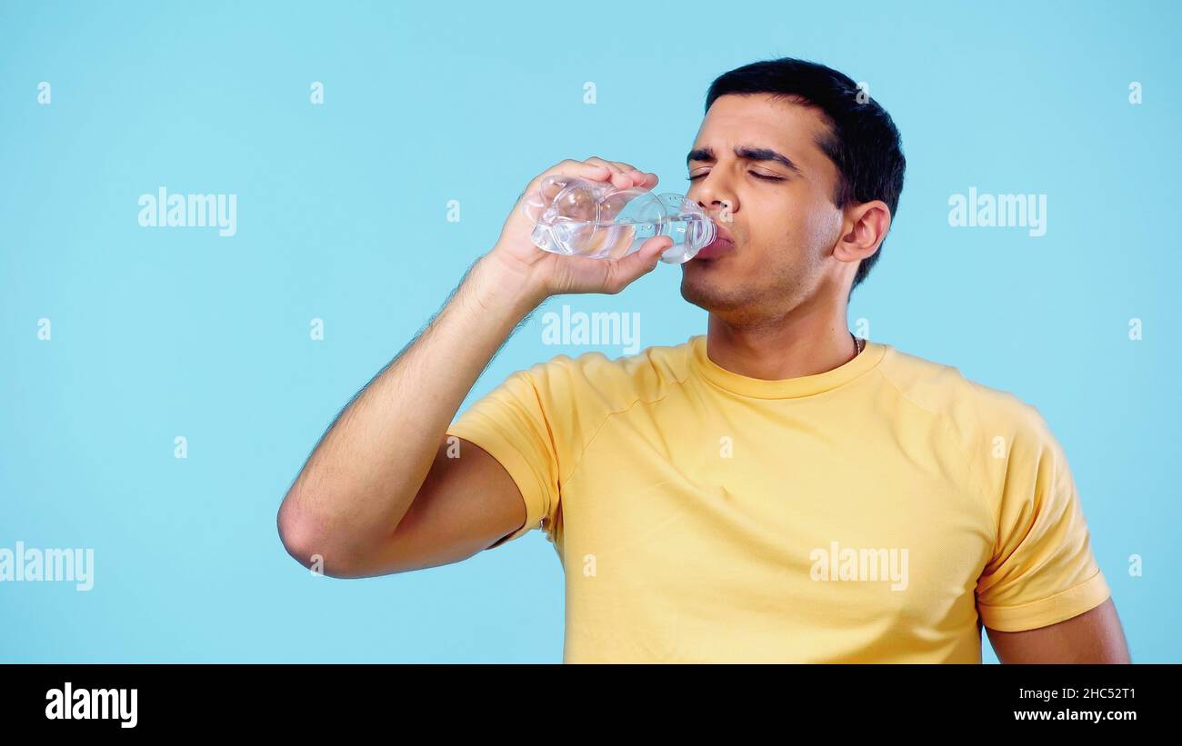 Young man drinking water from bottle hi-res stock photography and ...