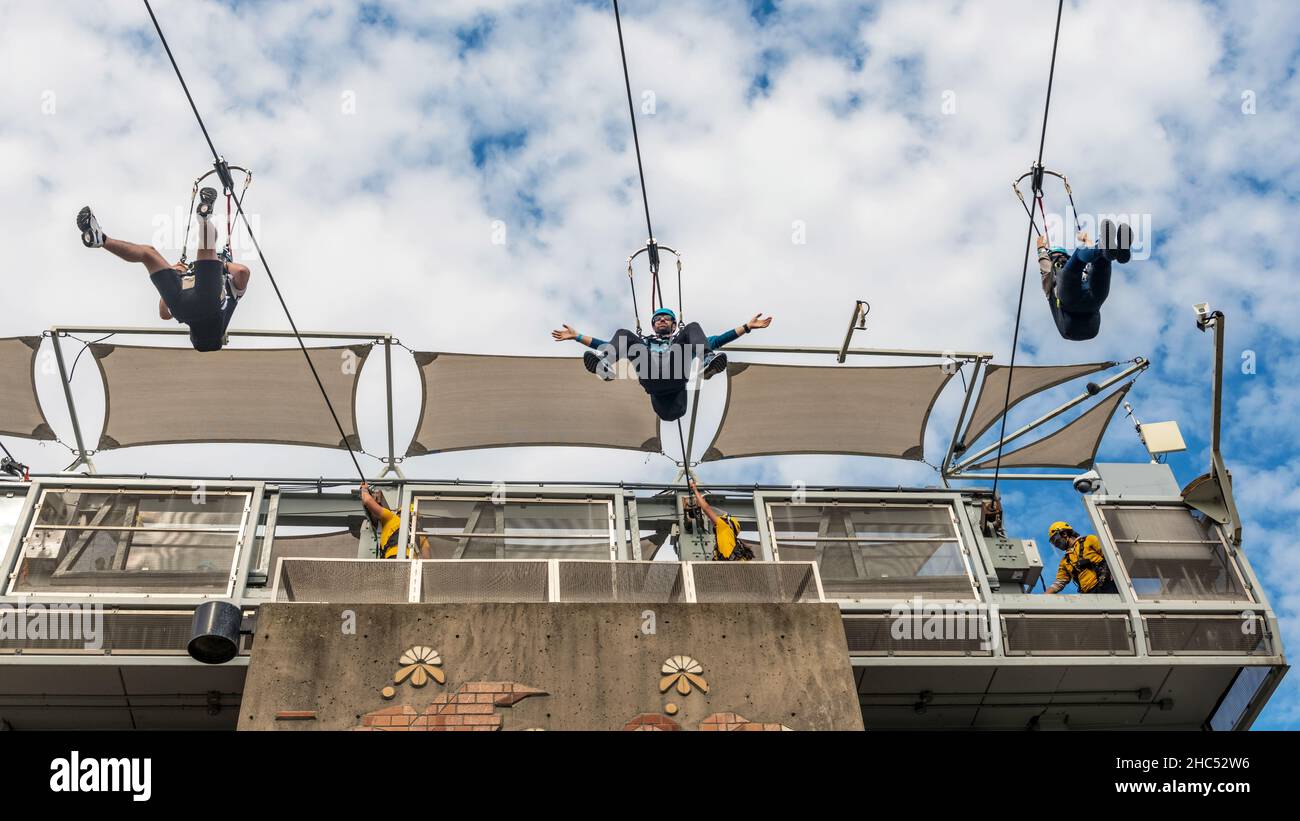 People using the Zipline attraction over the waterfalls, Niagara Falls ...