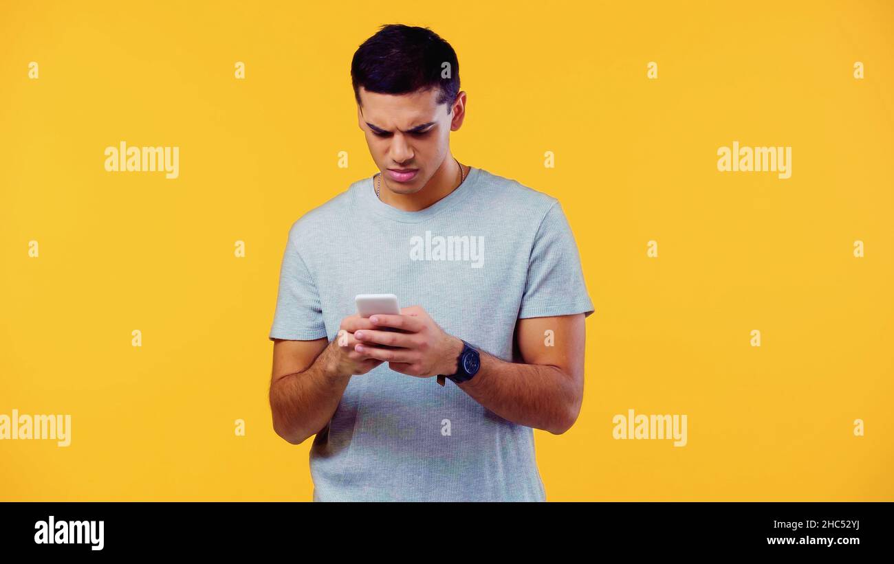 Sad displeased man smartphone typing hi-res stock photography and ...