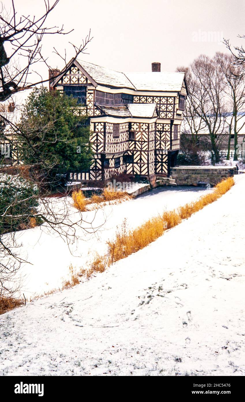 Cheshire winter landscape in the snow showing the moat around Little ...