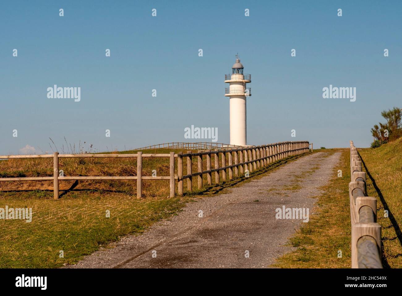 A lighthouse or light signaling tower located on the sea coast or on ...
