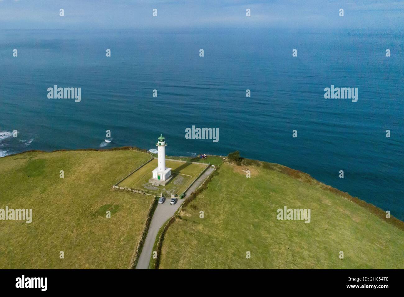 A lighthouse or light signaling tower located on the sea coast or on ...