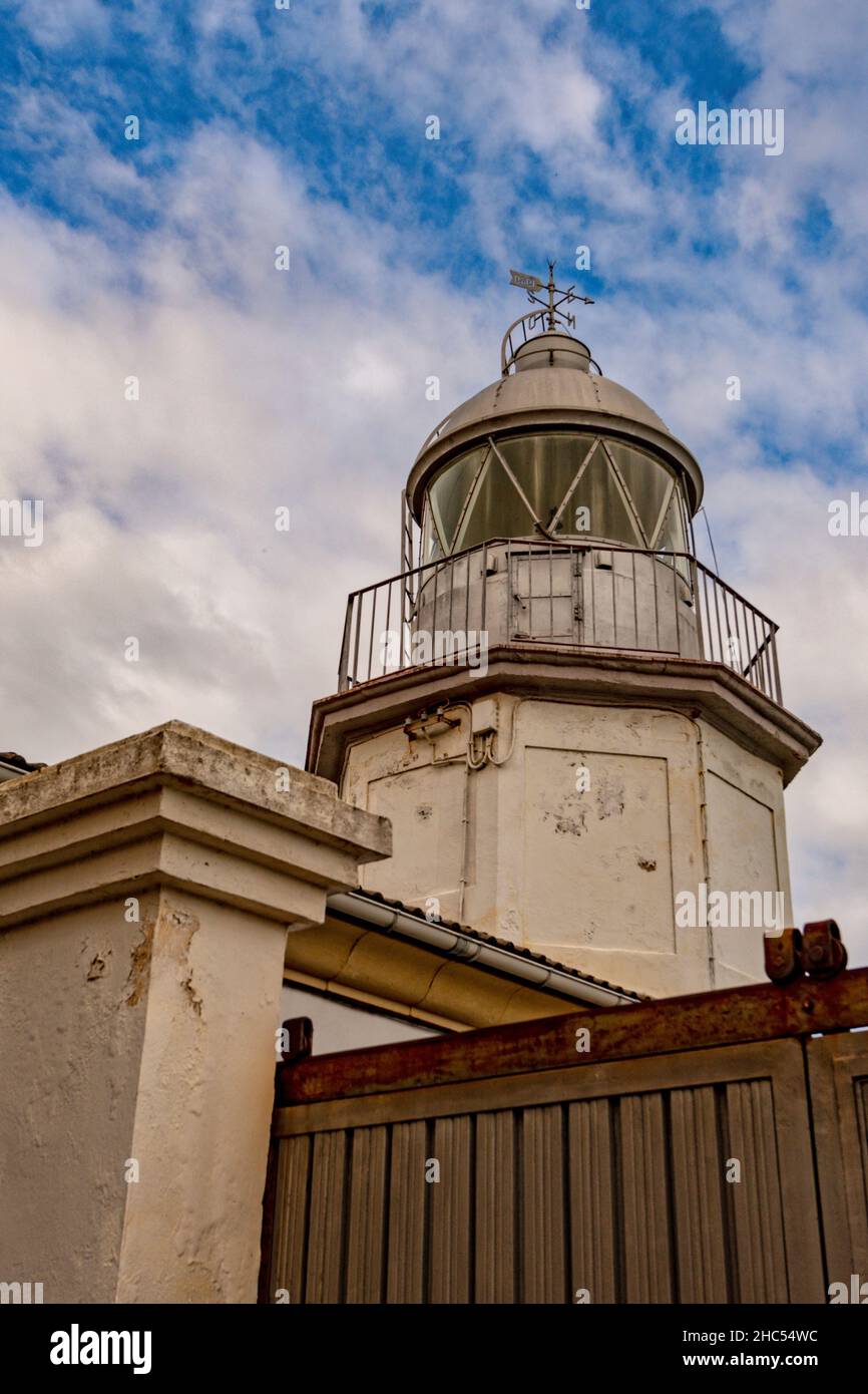 A lighthouse or light signaling tower located on the sea coast or on ...