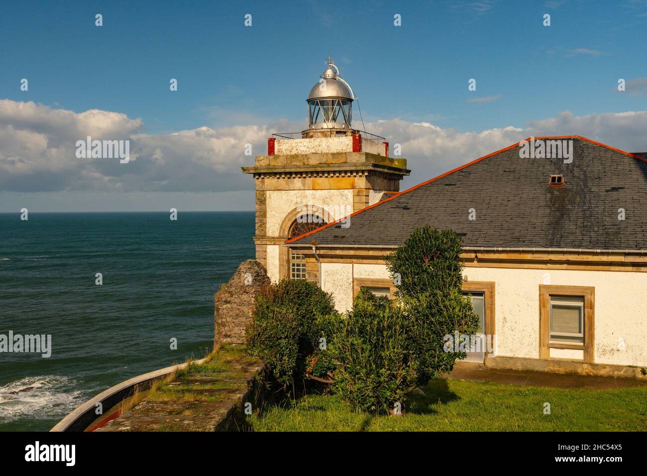 A lighthouse or light signaling tower located on the sea coast or on ...